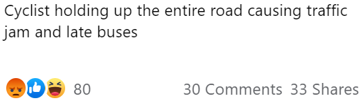 Cyclist riding on road holds up the entire lane, causing traffic jam ...